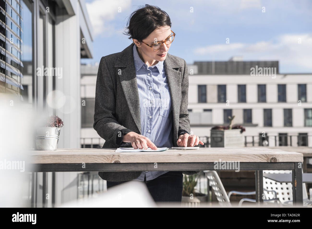 Mobile phone on roof terrace hi-res stock photography and images - Alamy
