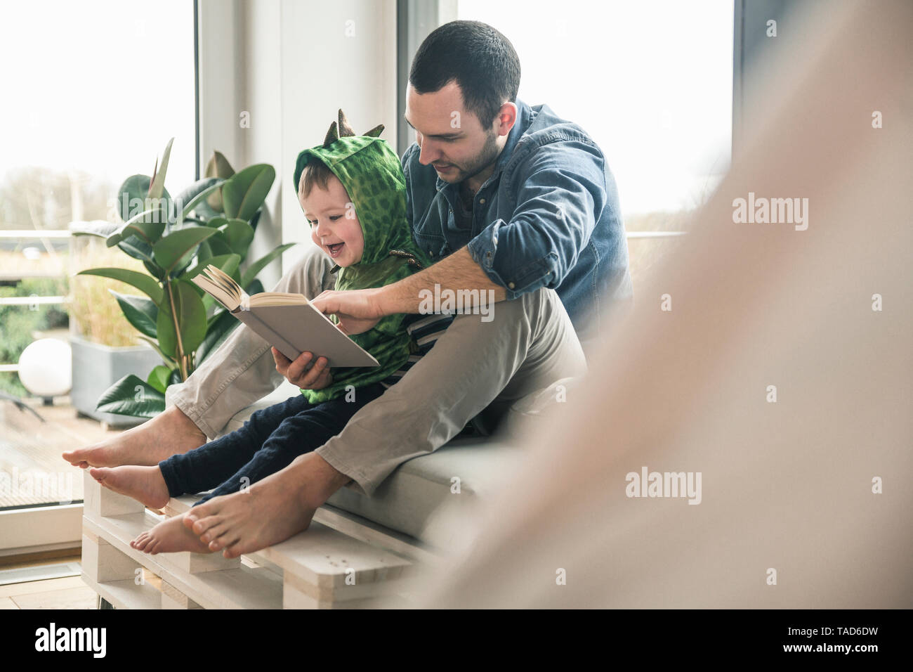 Child in fancy dress reading a book hi-res stock photography and images ...