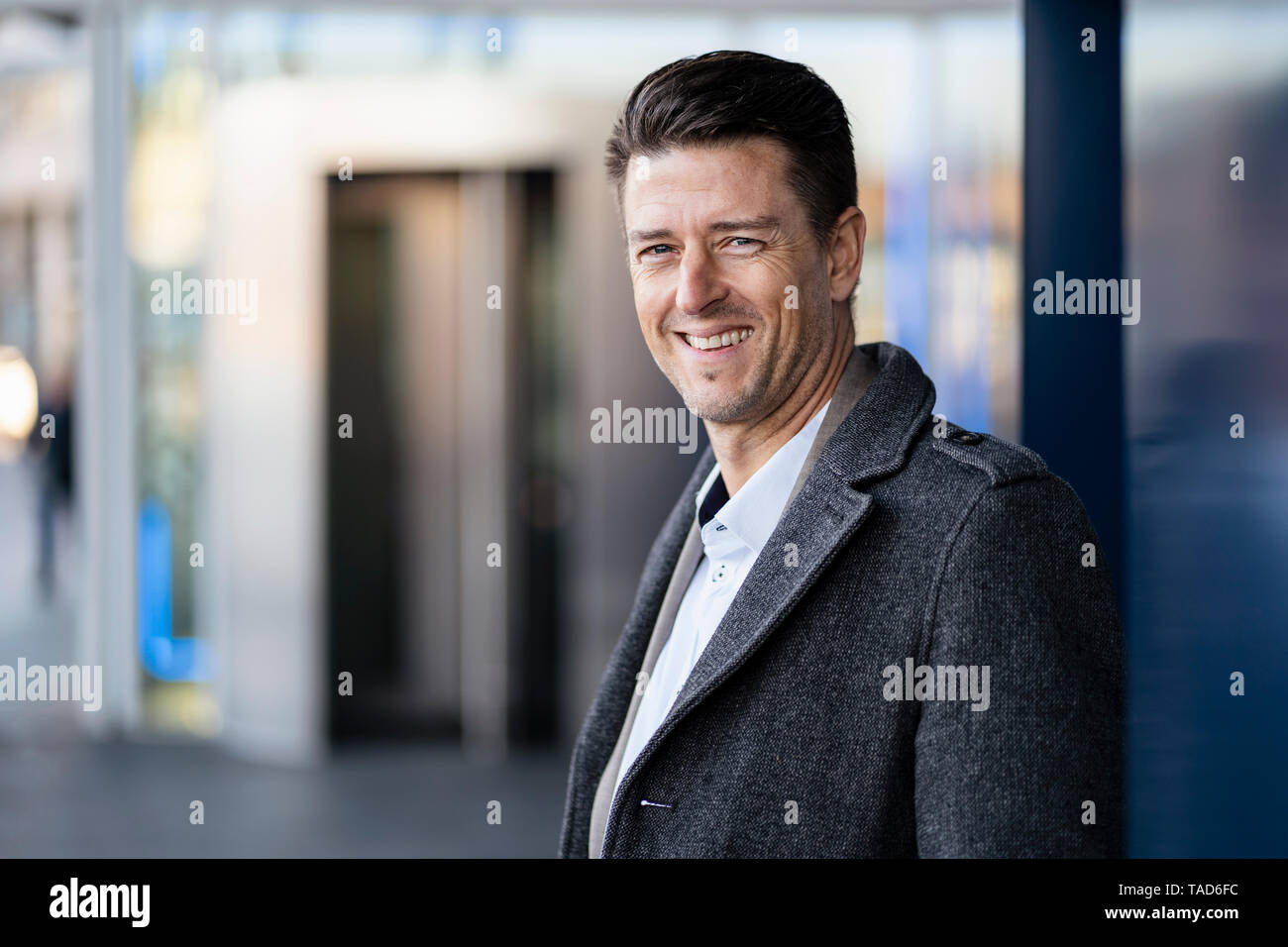 Portrait of a businessman smiling Stock Photo - Alamy