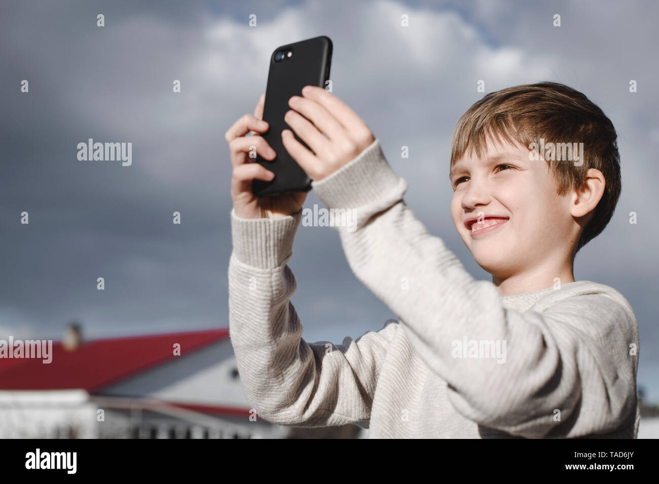 Happy boy smartphone hi-res stock photography and images - Alamy