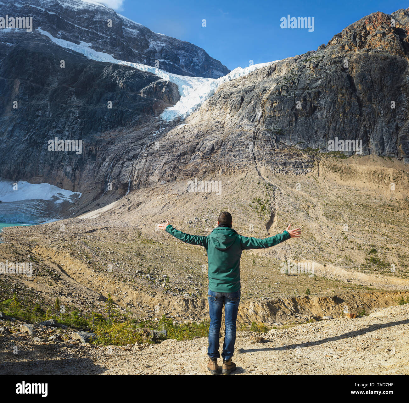 Canada, Jasper National Park, Hiker with raising arms at Mount Edith ...