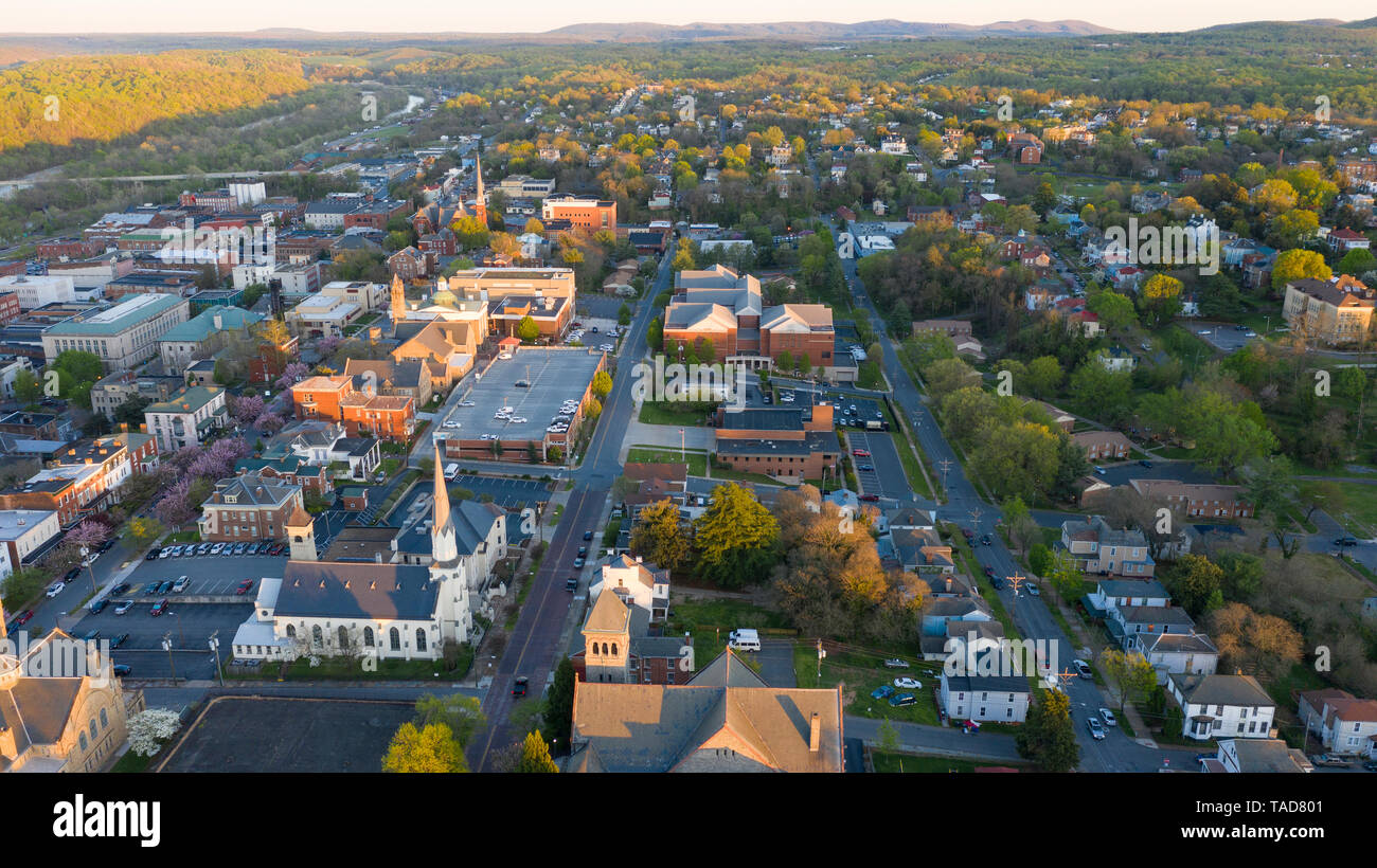 Long shadows light up the buildings in the hilltop village of Lynchburg ...