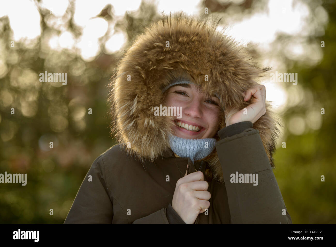 Woman wearing fur hood hi-res stock photography and images - Alamy