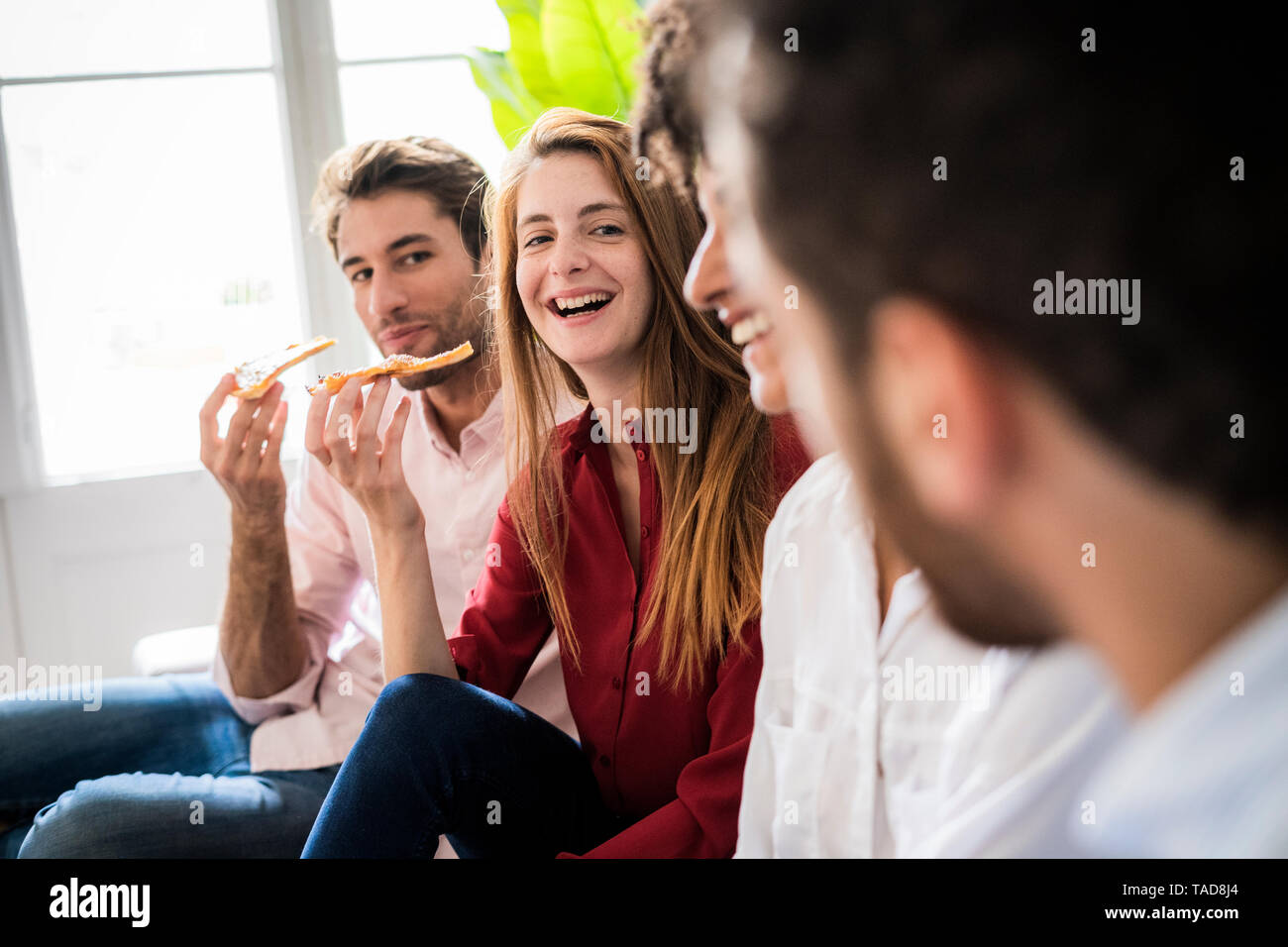 Friends having fun, eating pizza Stock Photo - Alamy