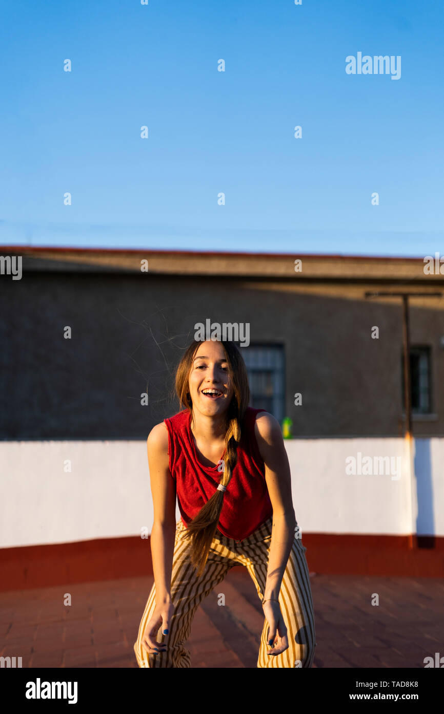 Girl on roof hi-res stock photography and images - Alamy