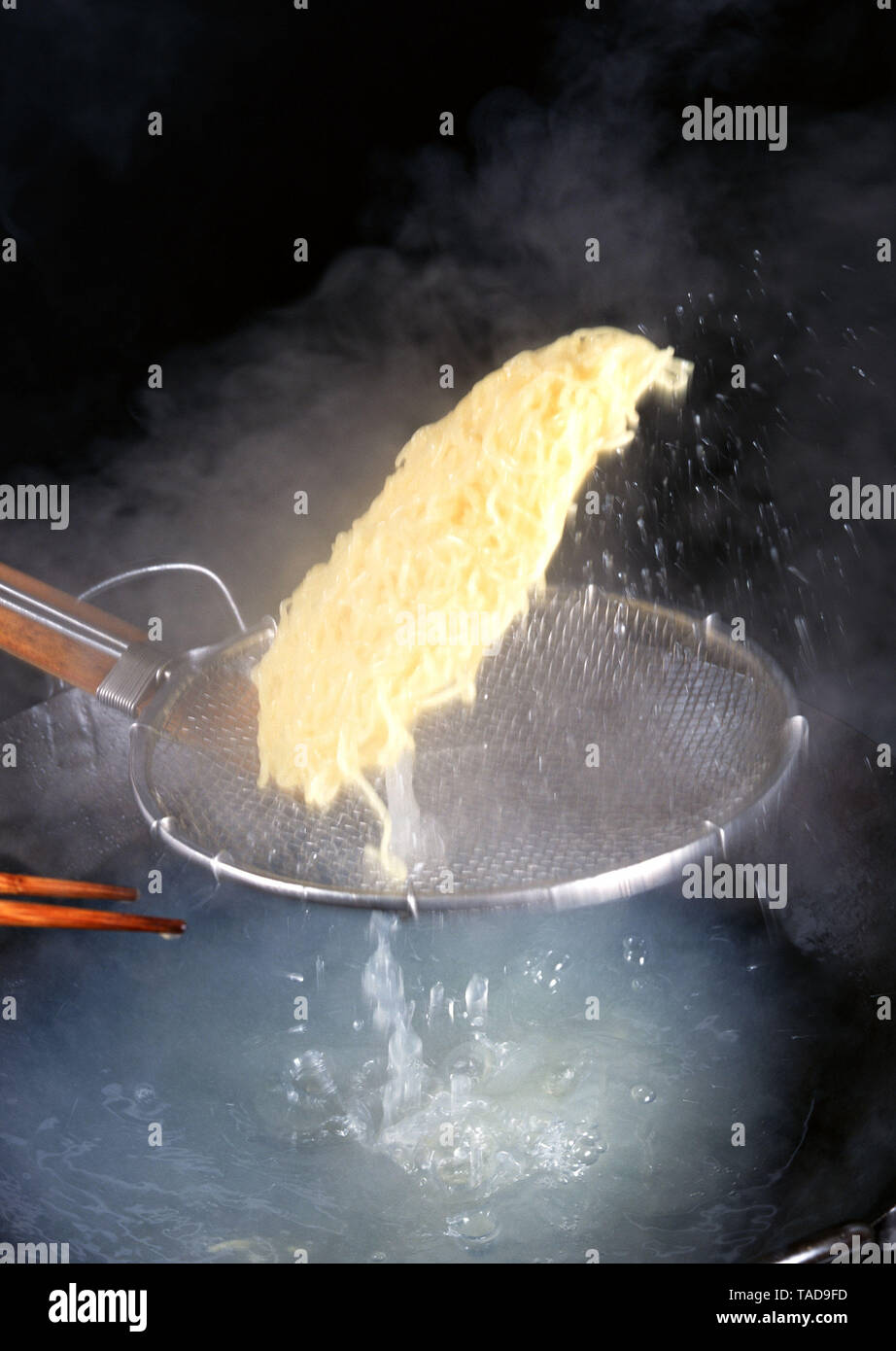 the process of cooking noodles Stock Photo - Alamy