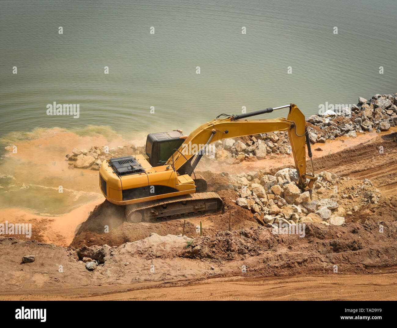 backhoe loader digger working on construction site riverside Stock ...