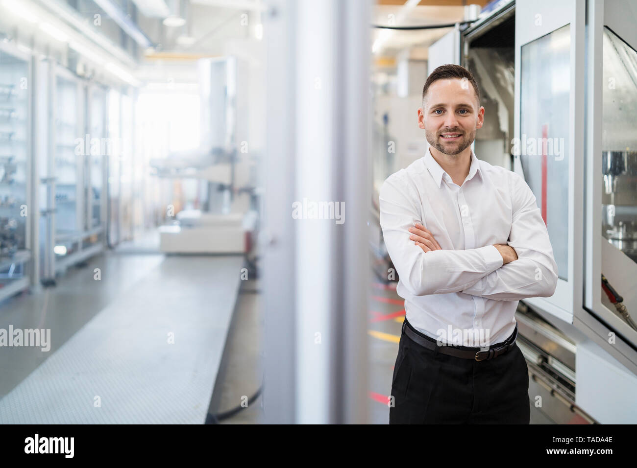 Businessman standing in shop floor hi-res stock photography and images ...