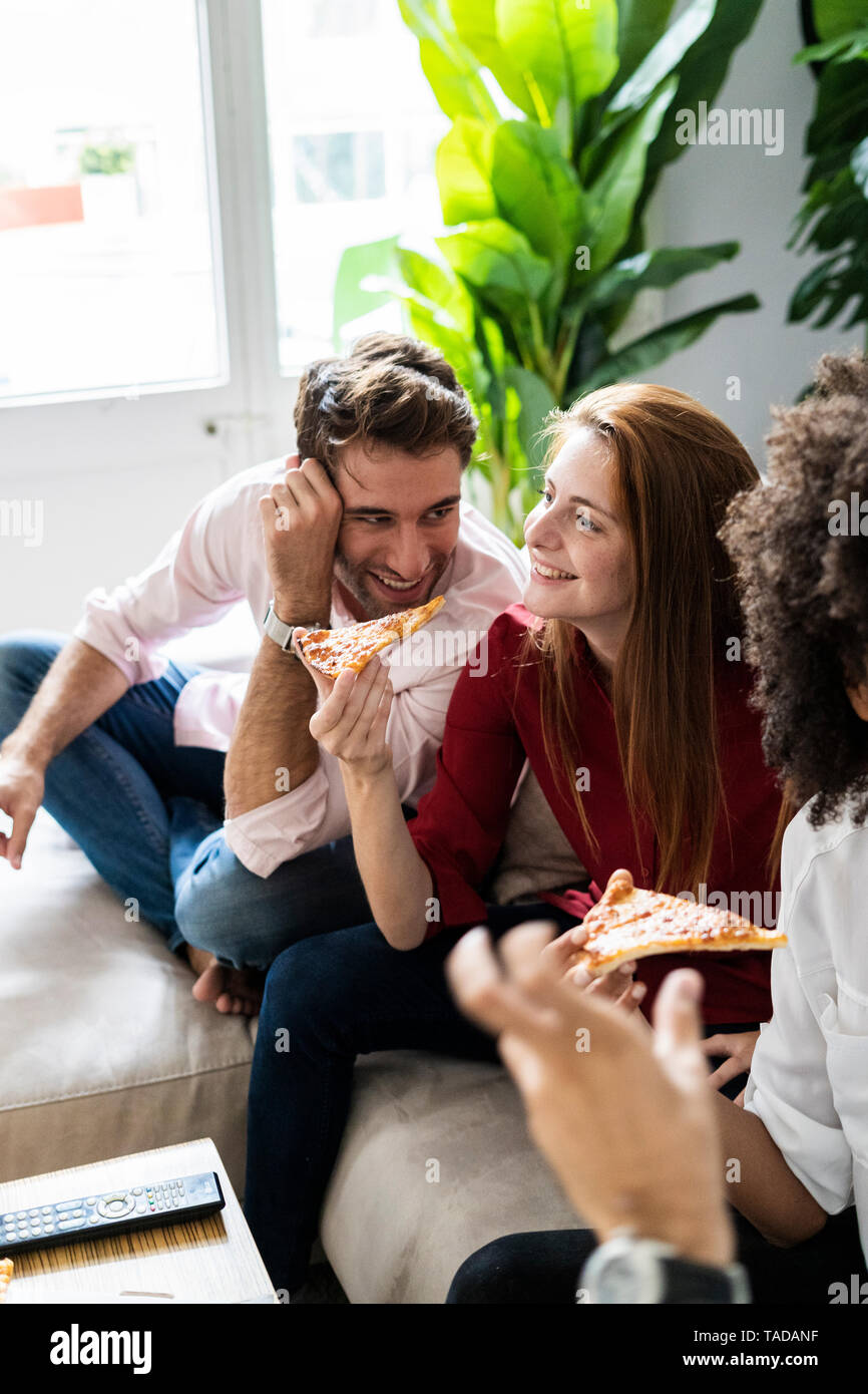 Friends having fun, eating pizza Stock Photo - Alamy