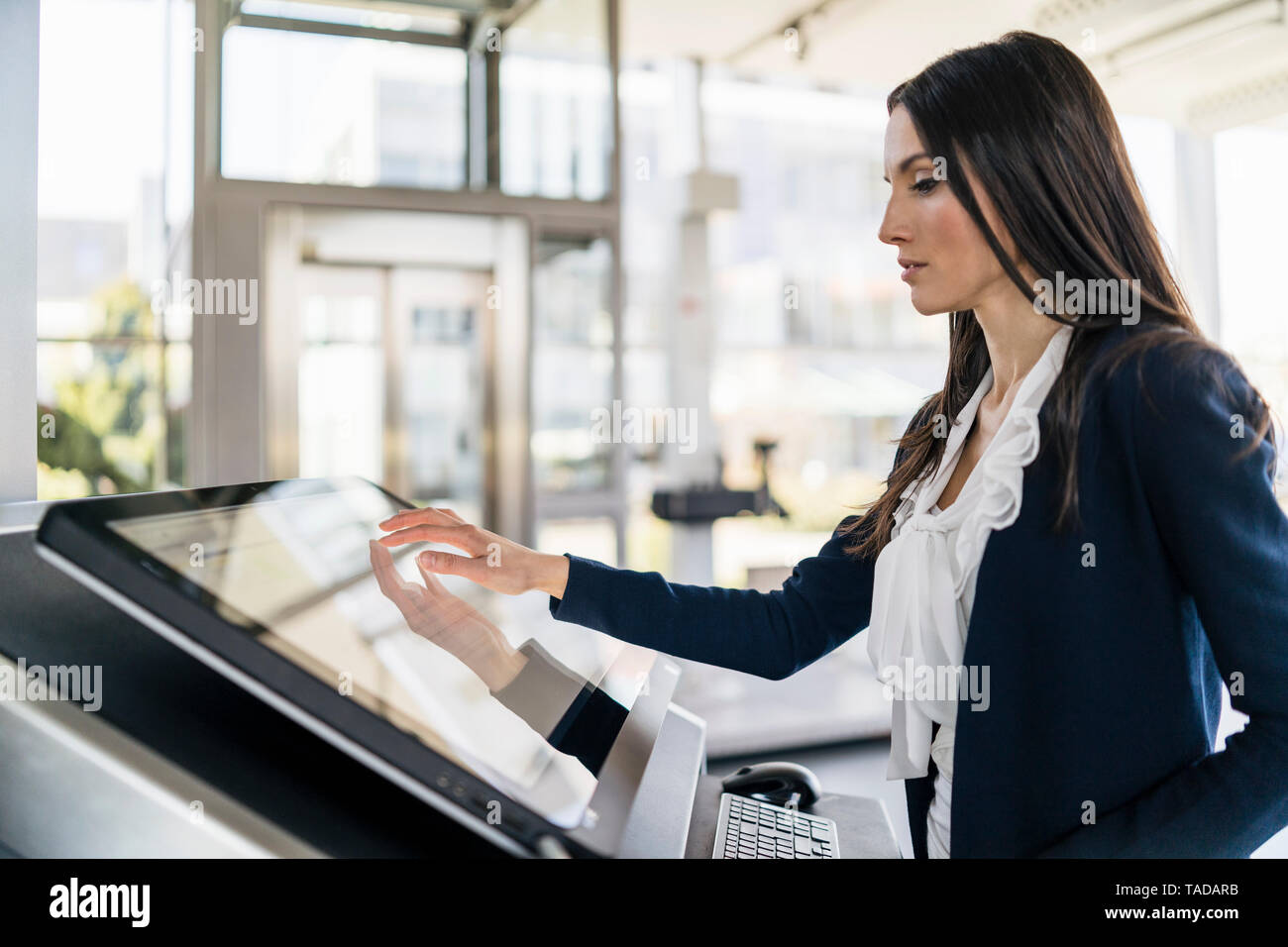 Woman operating a machine hi-res stock photography and images - Alamy