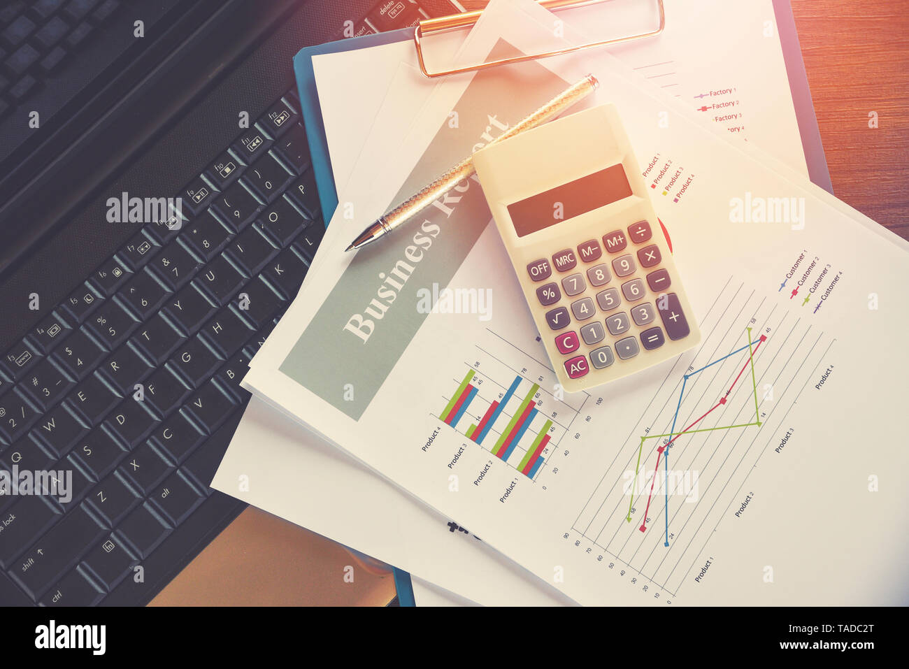 Business report chart preparing graphs calculator on laptop / Summary ...