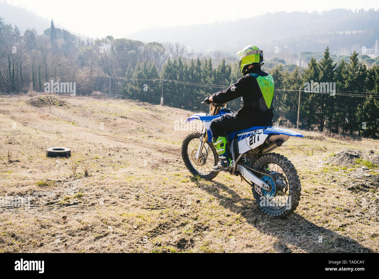 Motocross driver at circuit start Stock Photo - Alamy