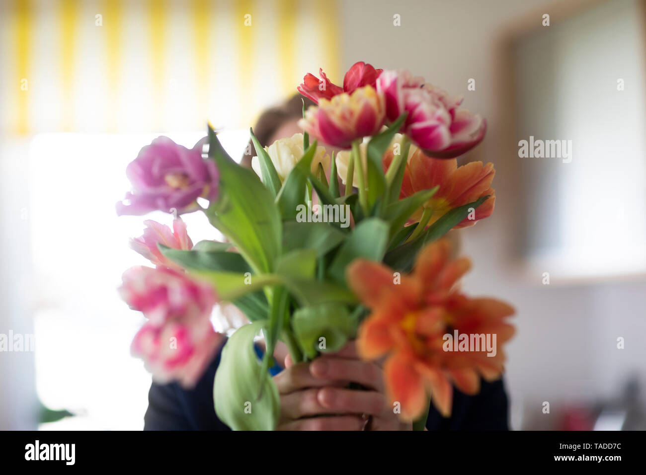 Woman hide flowers hi-res stock photography and images - Alamy