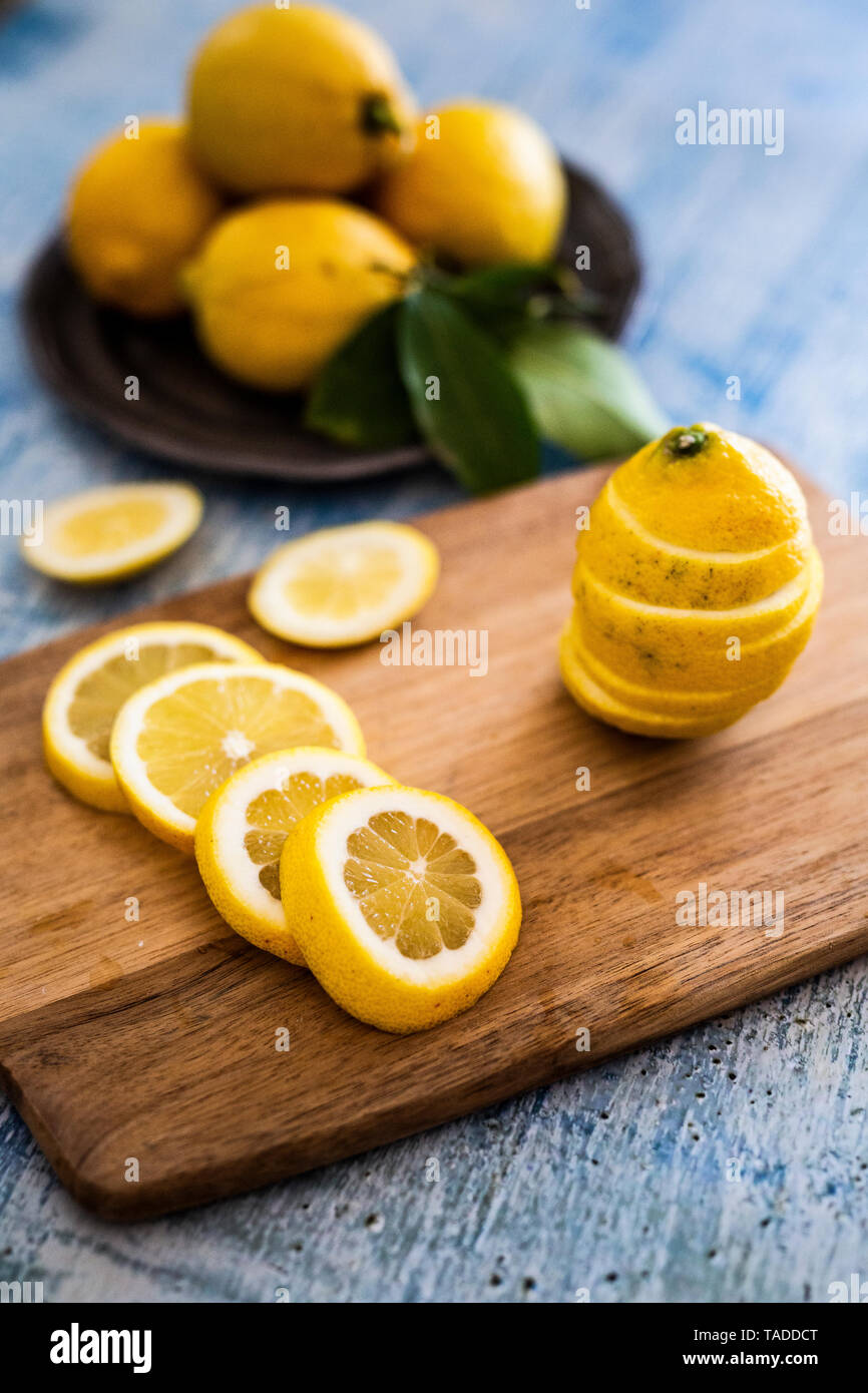 Sliced lemons on wooden board Stock Photo - Alamy