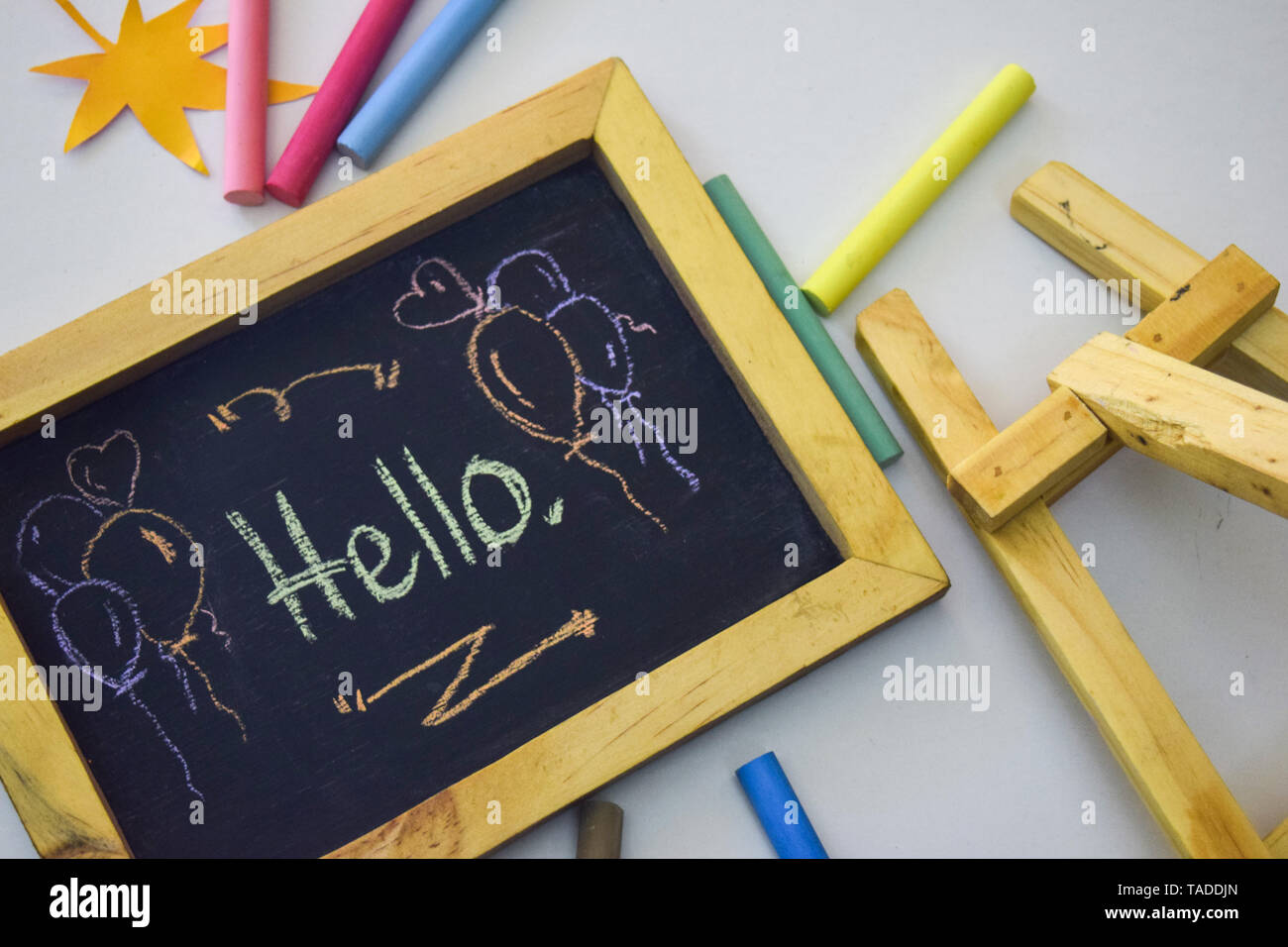Hello on the blackboard isolated white background Stock Photo - Alamy