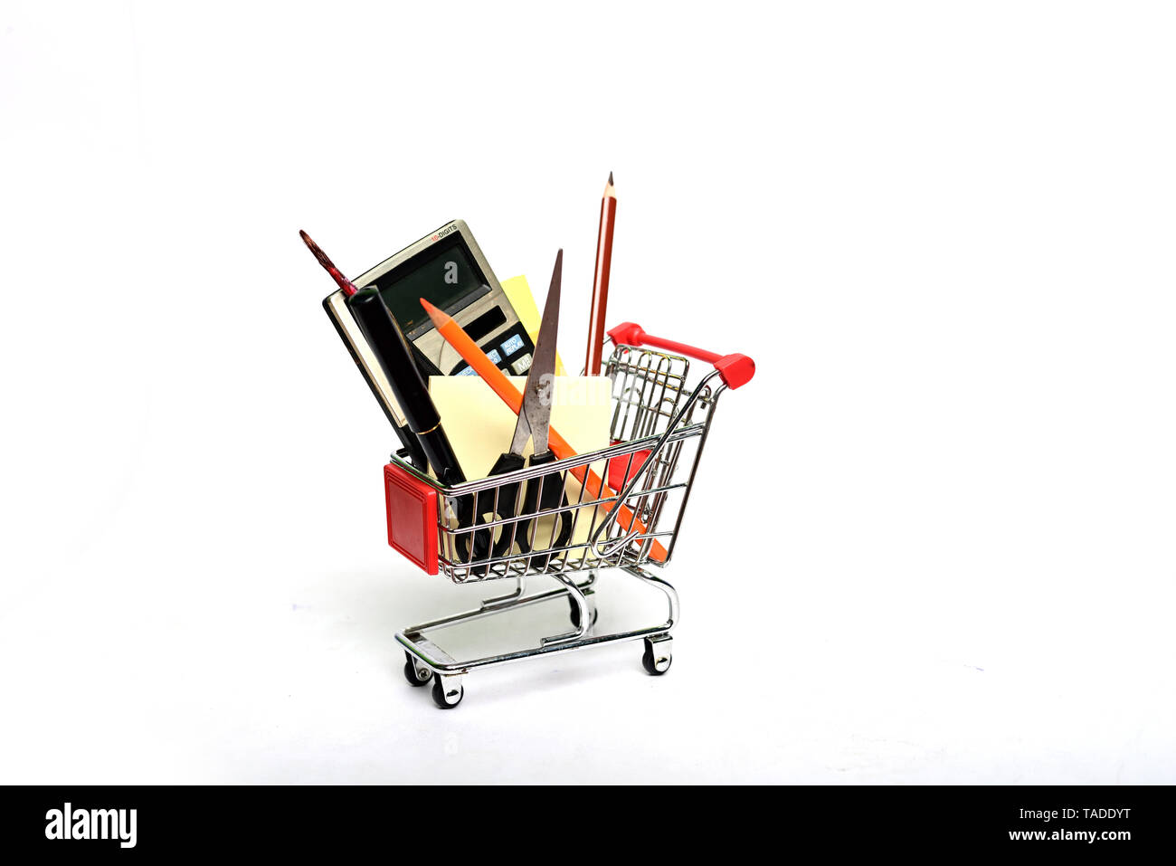 Shopping cart full with education goods for study om white background ...
