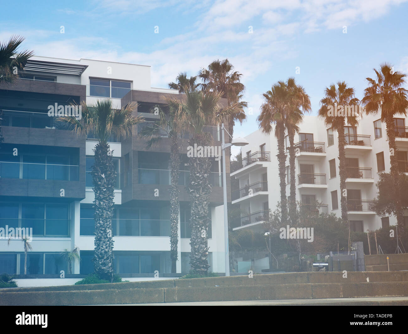Modern apartment buildings near a beach Stock Photo - Alamy