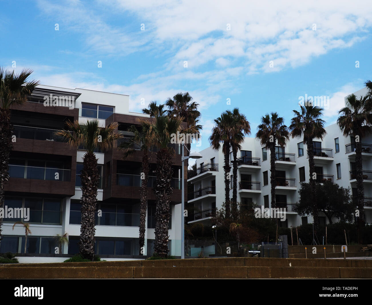 Modern apartment buildings near a beach Stock Photo - Alamy