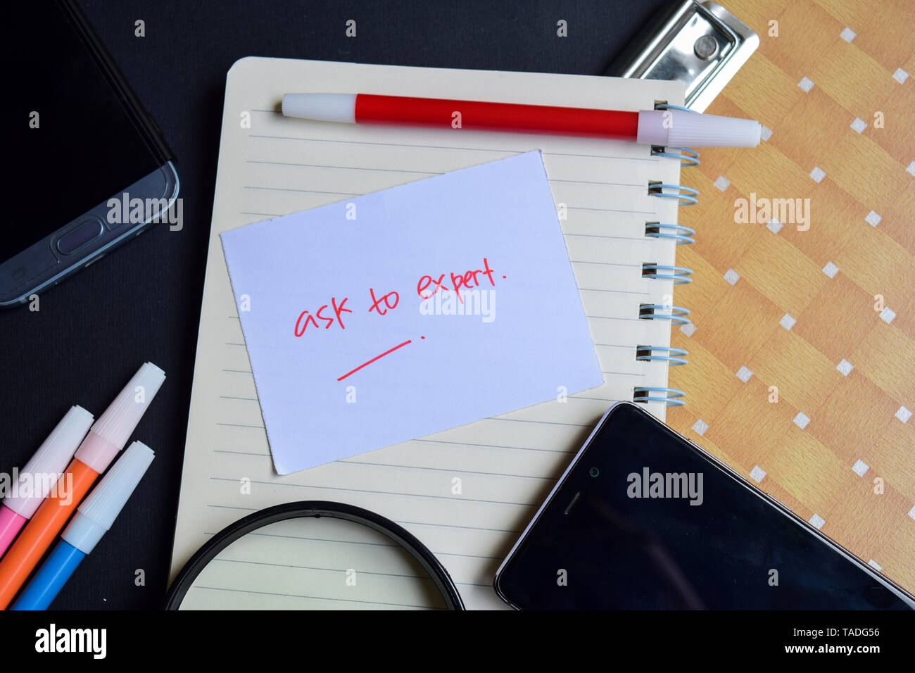 Ask to Expert written on paper isolated on black table Stock Photo - Alamy