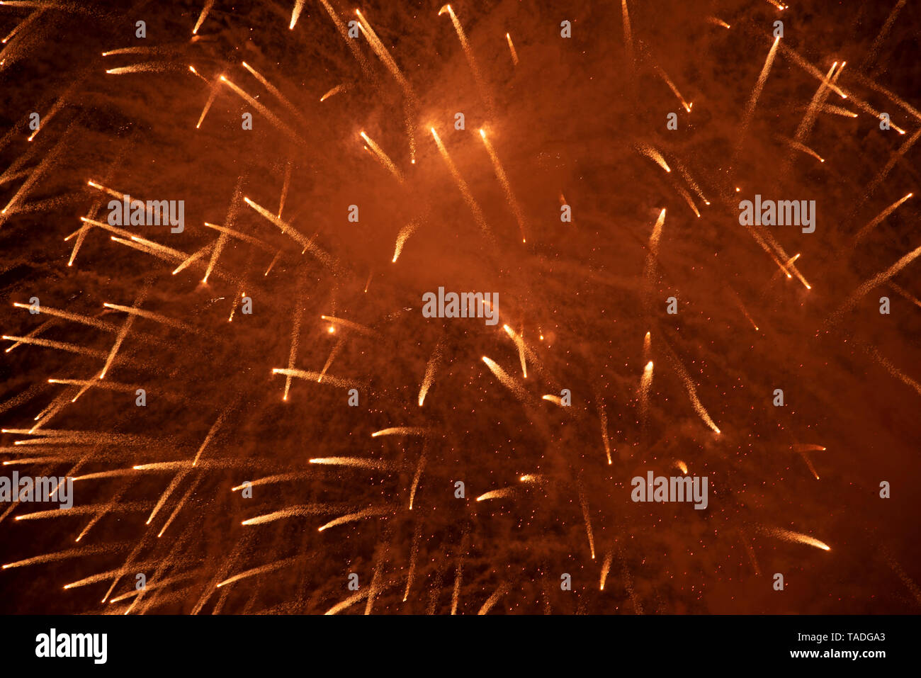 Fireworks against the dark sky. red black Stock Photo - Alamy
