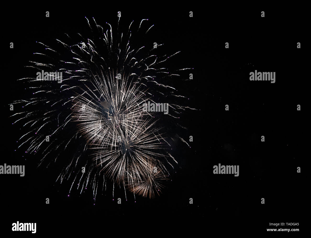Fireworks against the dark sky. red black Stock Photo - Alamy