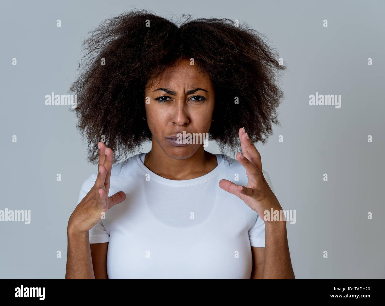 Portrait of attractive frustrated african american woman with angry and ...