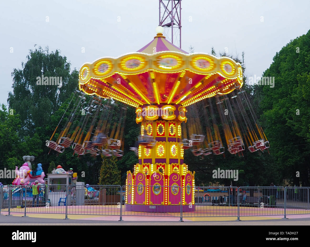 A vibrant and colourful vintage carousel at a Fairground Stock Photo ...