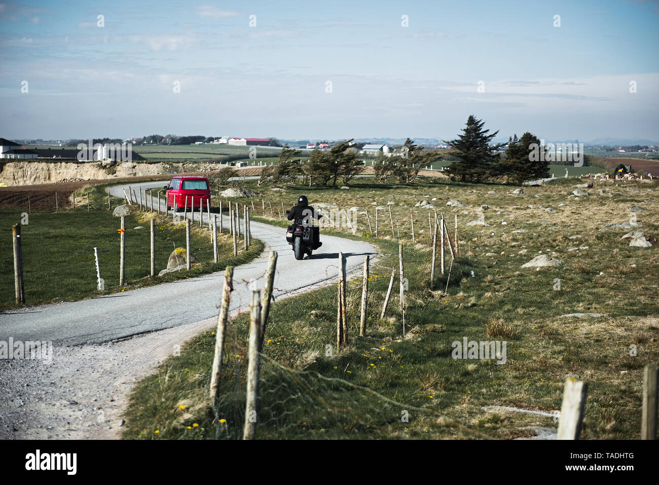 waved road background with small red bus and motocycle Stock Photo - Alamy