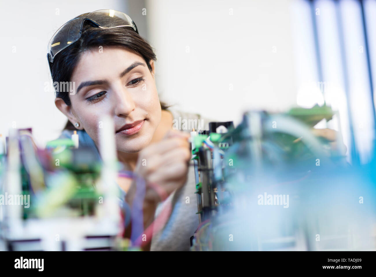 Woman working on motherboard Stock Photo - Alamy