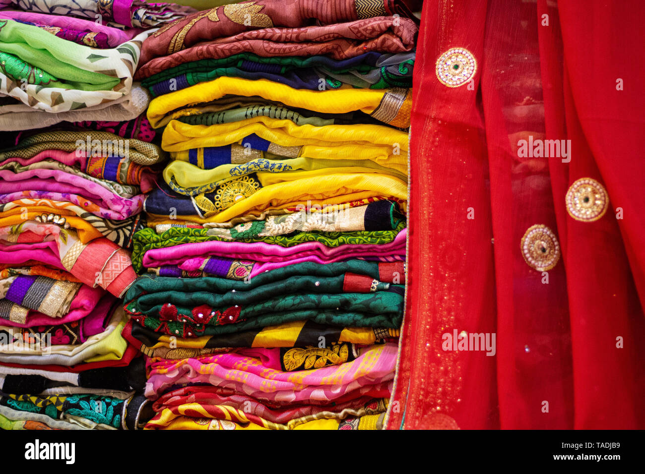 Stack of varied colorful sarees in India Stock Photo - Alamy
