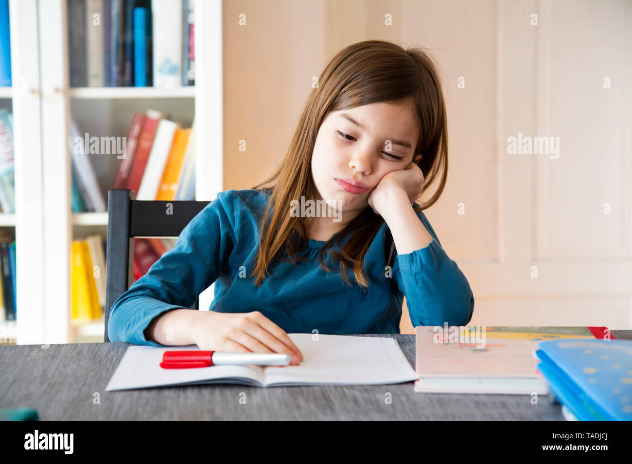 Frustrated girl with homework Stock Photo - Alamy