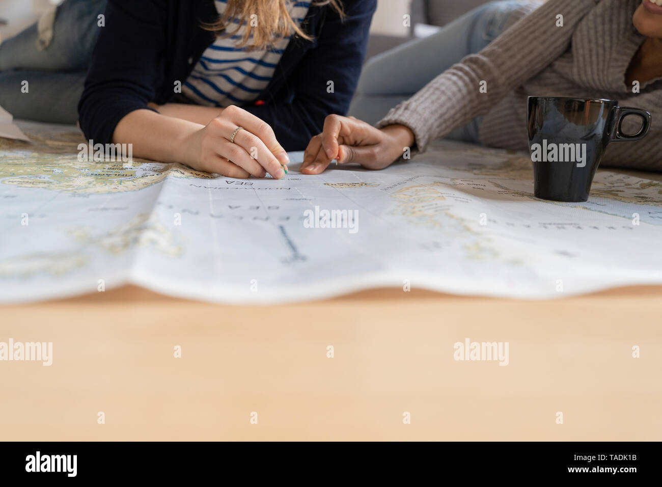 Friends putting pins on a map hi-res stock photography and images - Alamy
