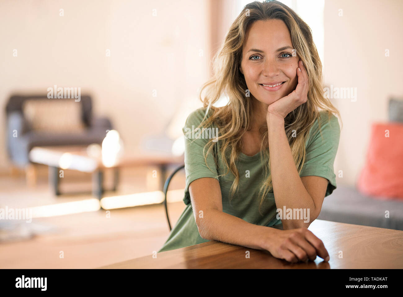Woman resting head on hand hi-res stock photography and images - Alamy