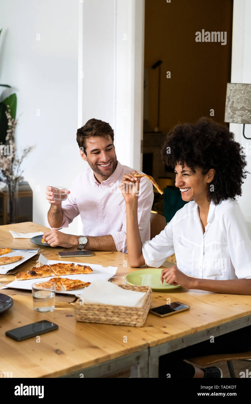 Friends having fun, eating pizza Stock Photo - Alamy