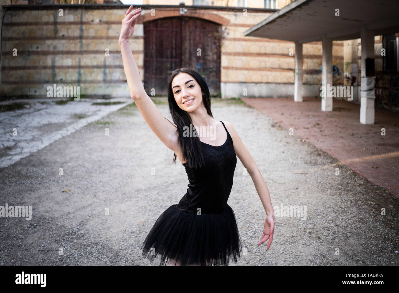 Italy, Verona, portrait of smiling Ballerina in the city Stock Photo ...