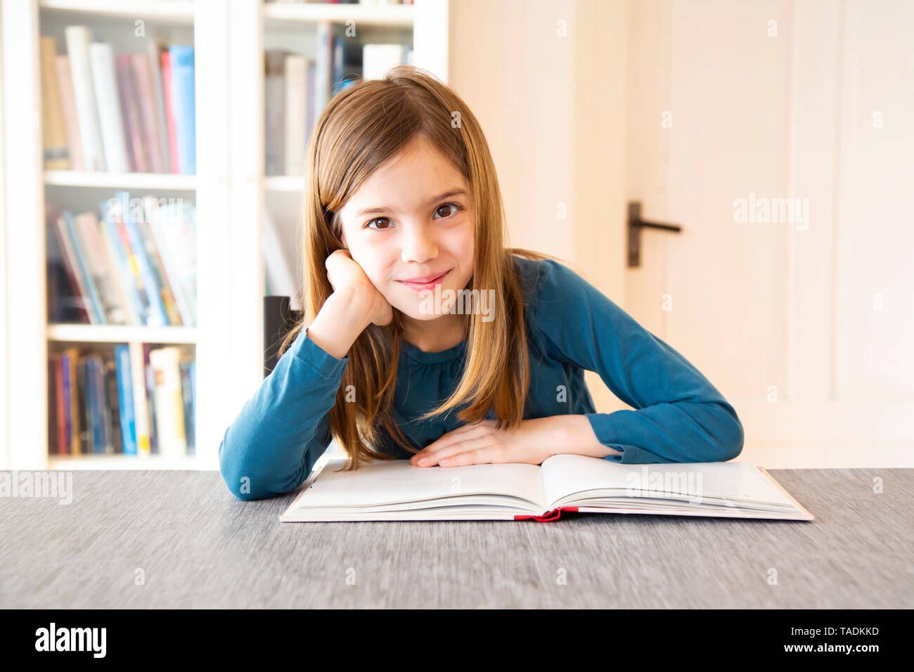 Girl reading a book Stock Photo - Alamy