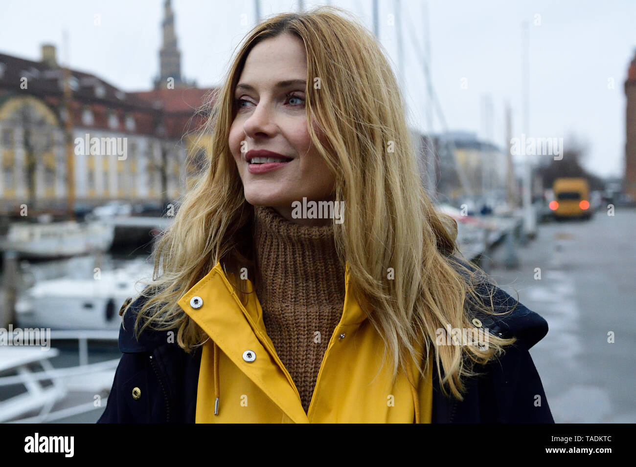 Denmark, Copenhagen, portrait of happy woman at city harbour Stock ...