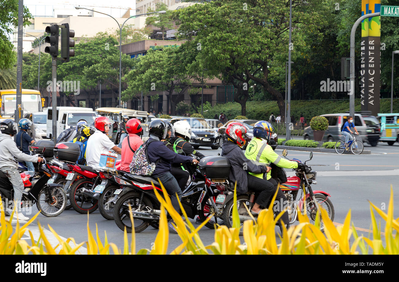 Bikers and cars waiting in traffic in Manila, Makati, Philippines Stock ...