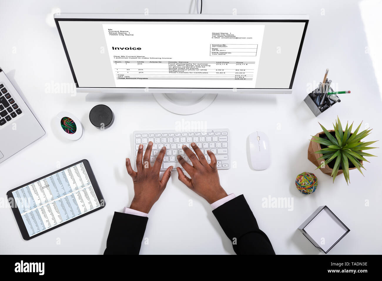Side View Of Young Businesswoman Calculating Invoice On Computer Screen ...