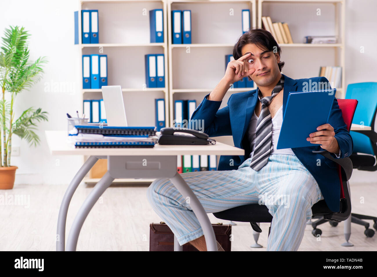 Employee coming to work straight from bed Stock Photo - Alamy