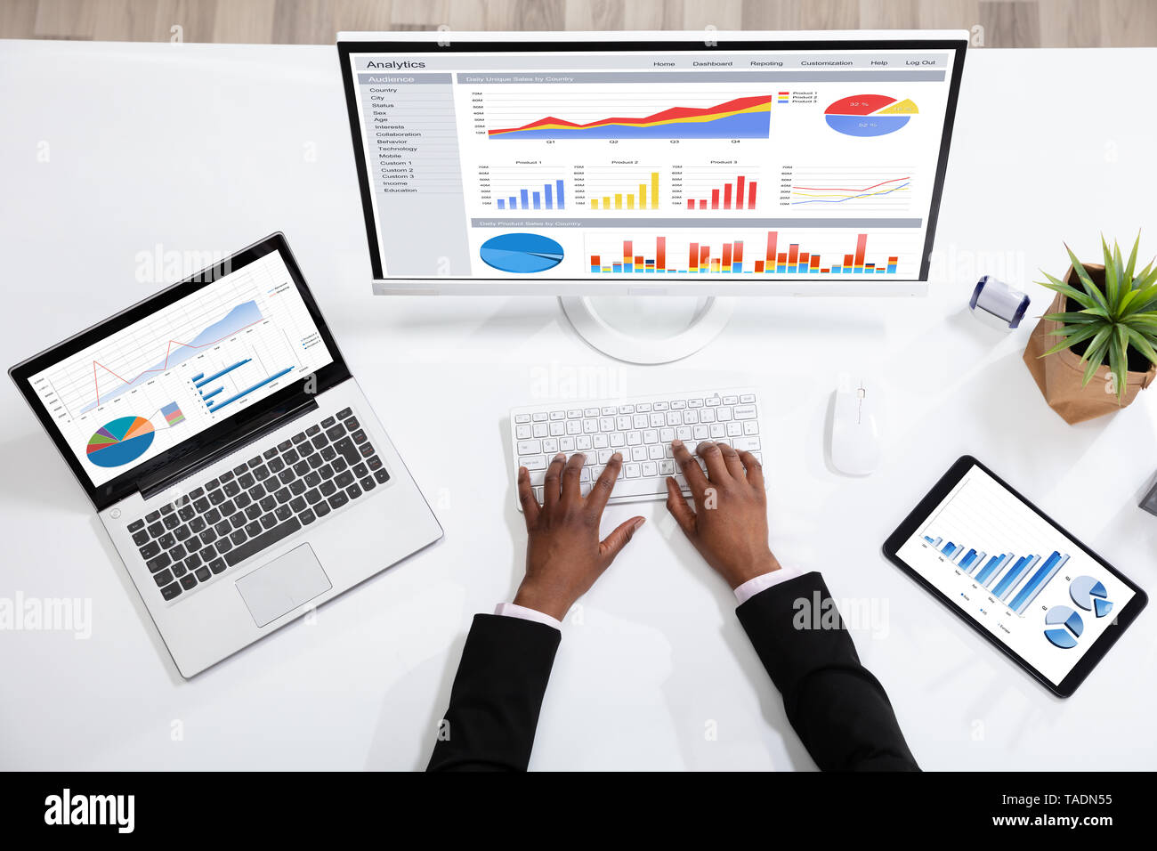 An Elevated View Of Businesswoman's Hand Analyzing Statistics On ...