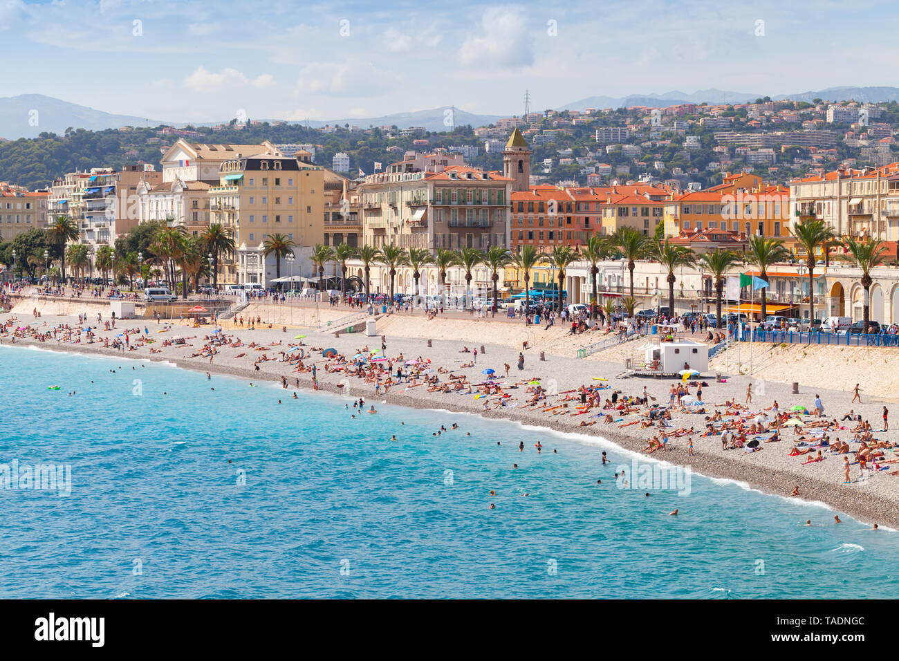 Coastal landscape with people resting on the beach along the Promenade ...