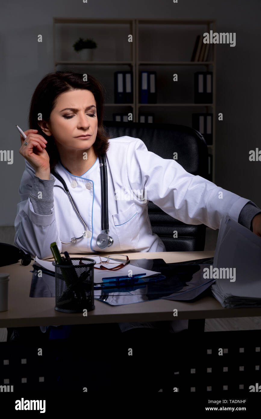 Female medical professional working late hi-res stock photography and ...