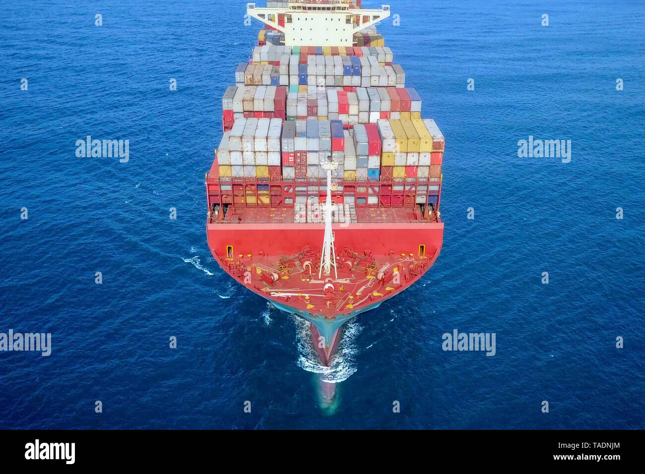 Aerial footage of an Ultra large container vessel (ULCV) cruising in ...