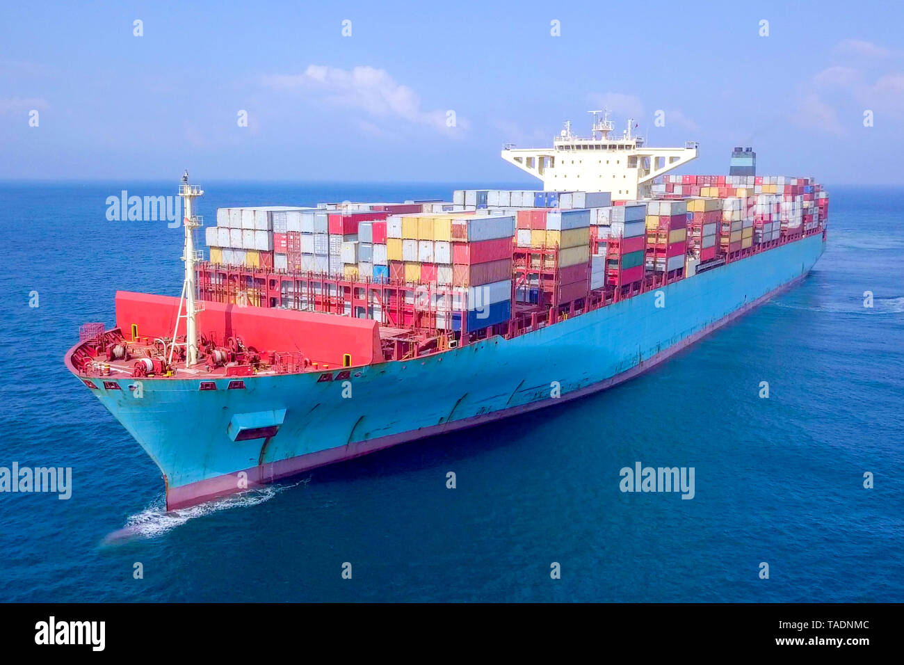 Aerial footage of an Ultra large container vessel (ULCV) cruising in ...