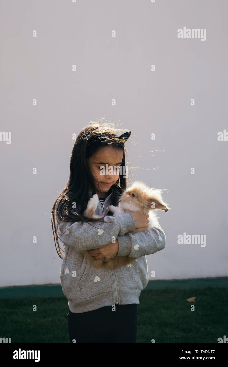 Girl holding bunny hi-res stock photography and images - Alamy