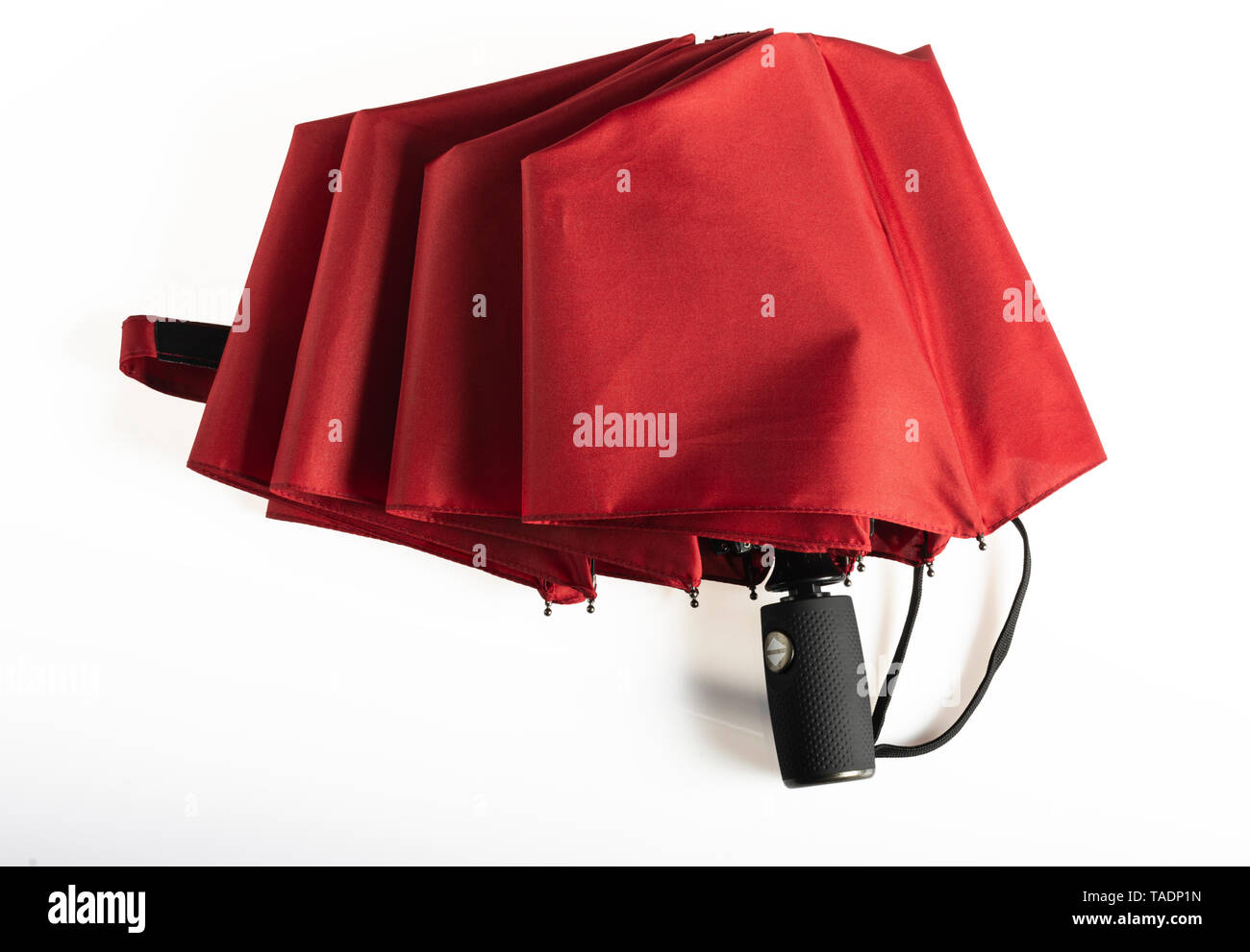 Unfolded compact umbrella isolated on white Stock Photo - Alamy