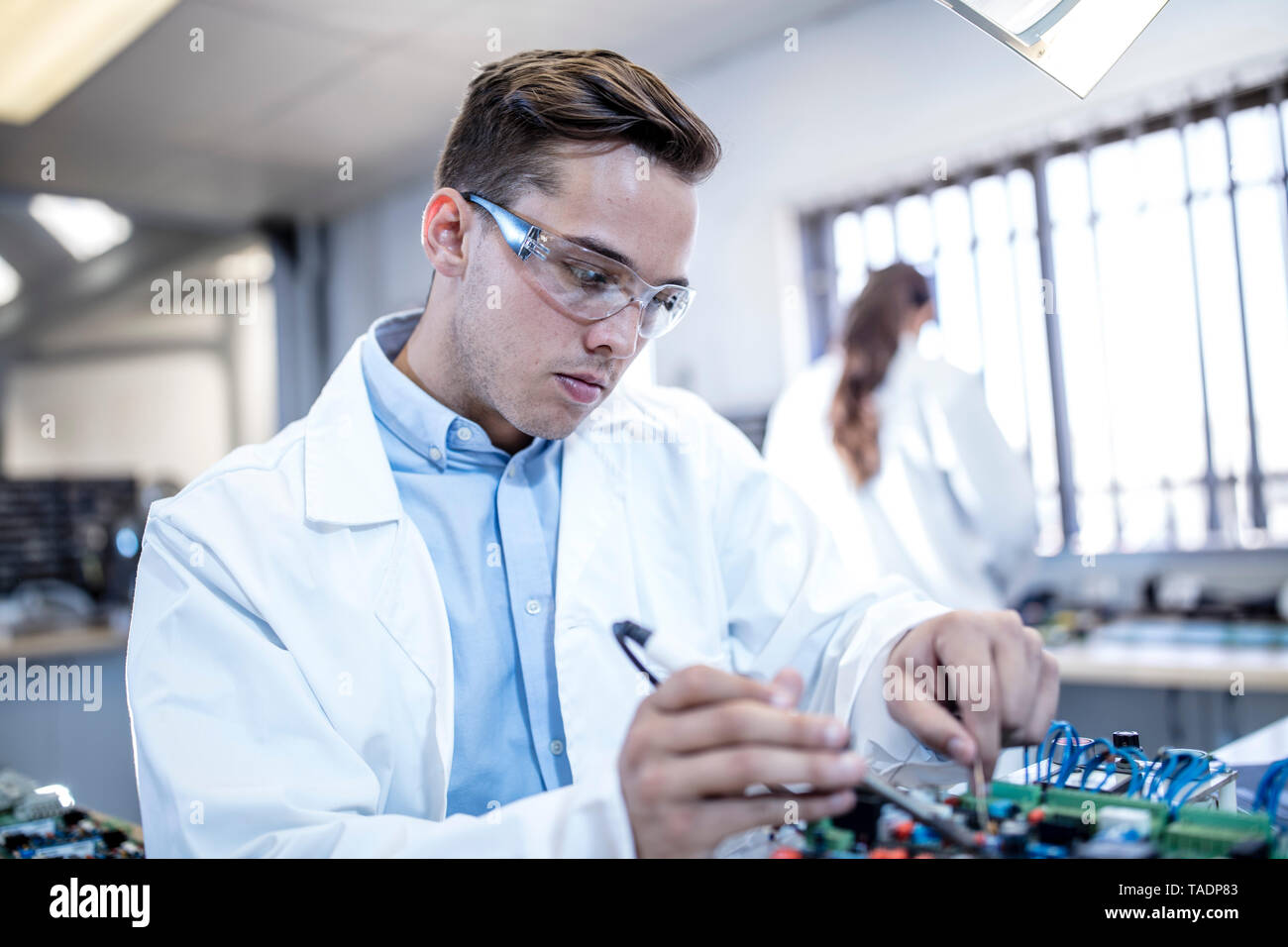 Technician working on motherboard Stock Photo - Alamy