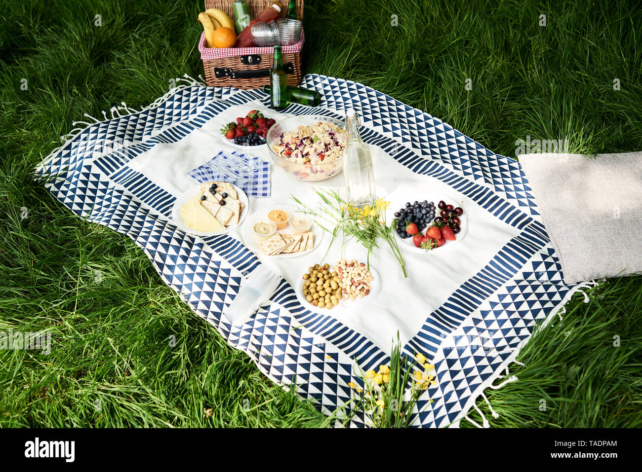 Healthy picnic snacks on a blanket in grass Stock Photo - Alamy