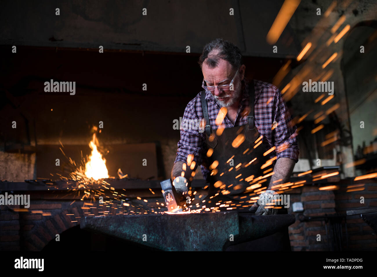 Blacksmith working at the anvil hi-res stock photography and images - Alamy